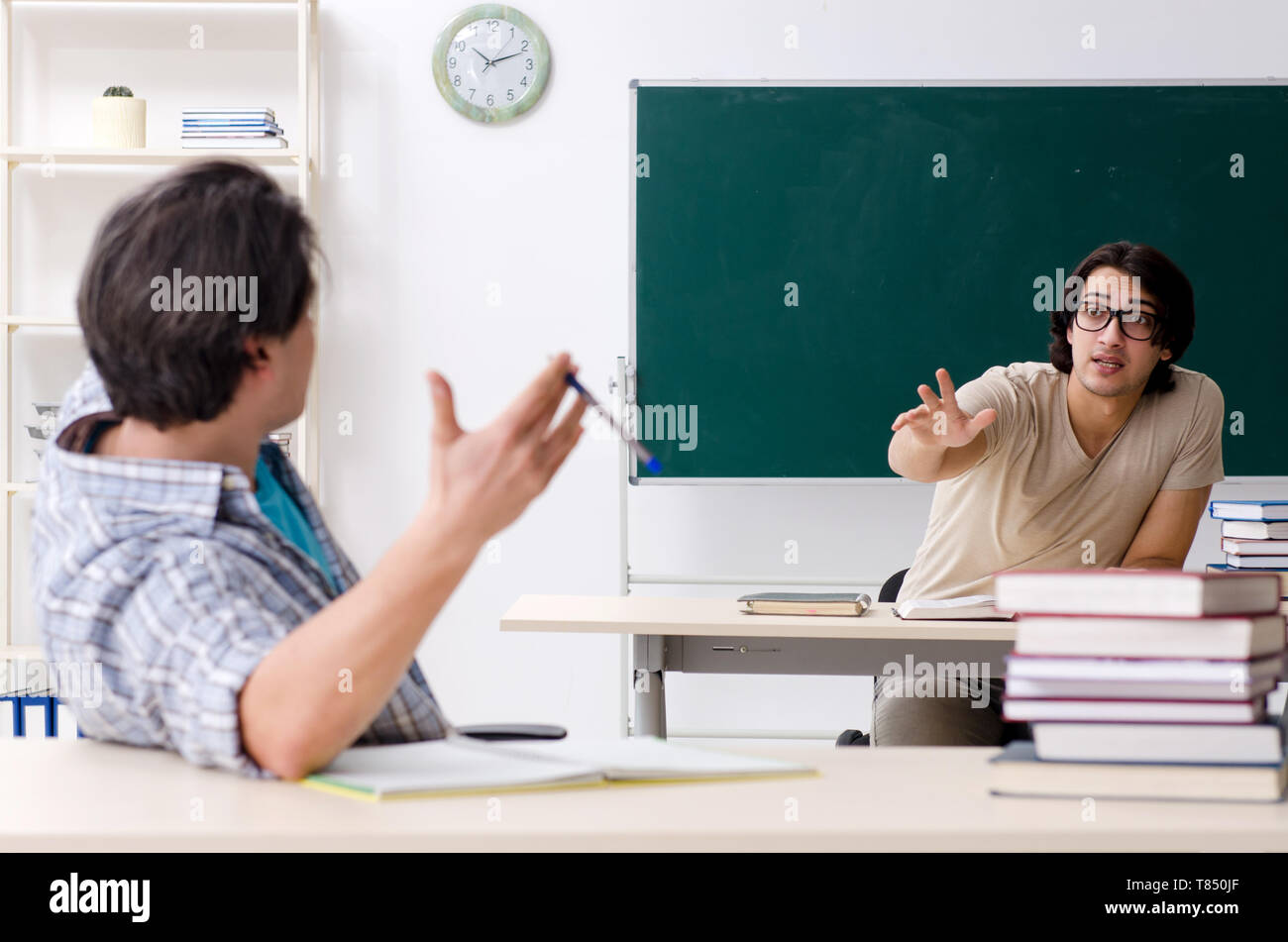 Two male students in the classroom Stock Photo - Alamy