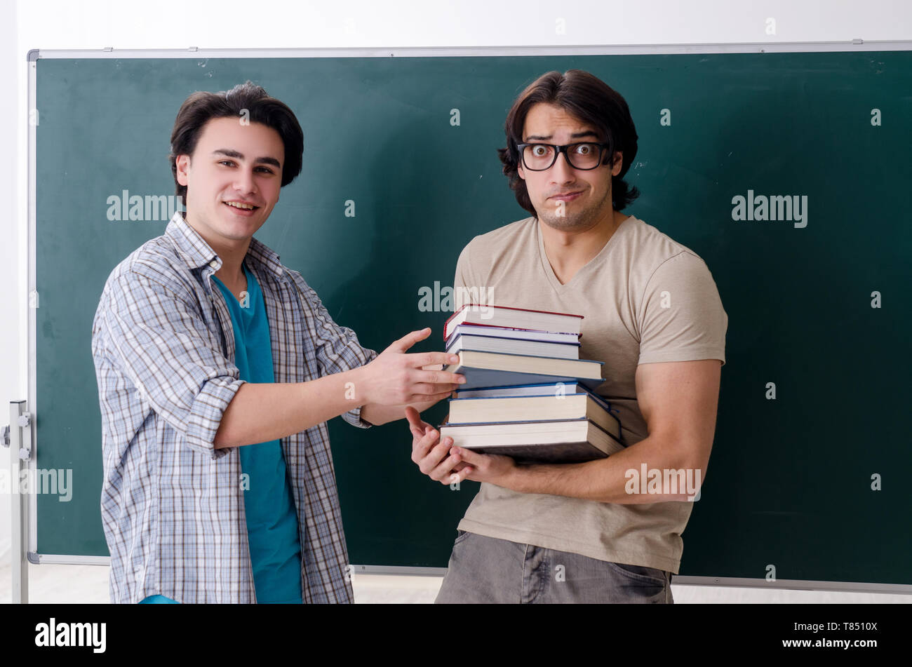 Two male students in the classroom Stock Photo - Alamy