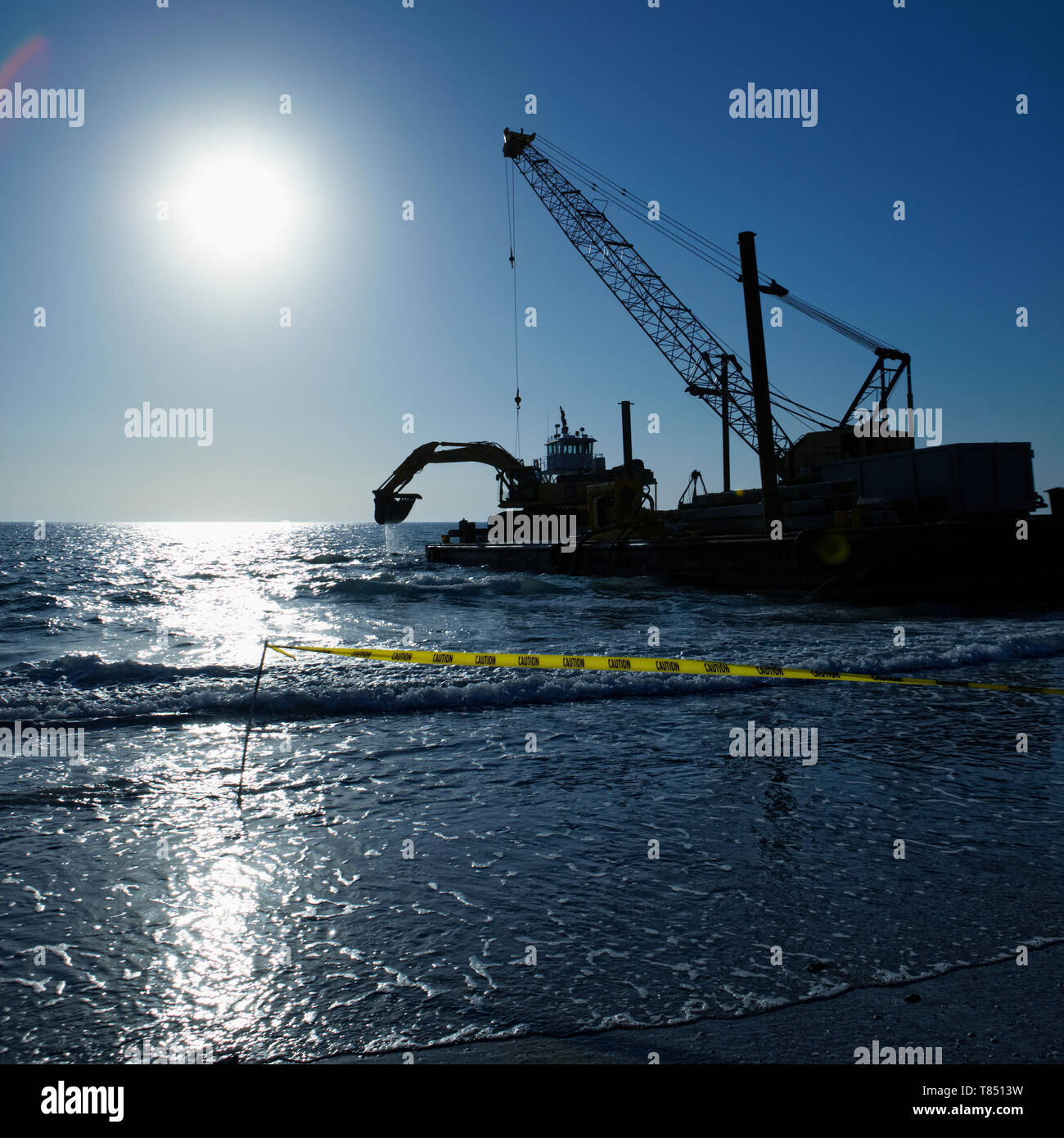 Machinery Cleaning Up a Pier Stock Photo - Alamy