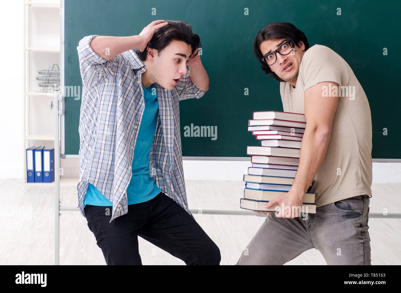 Two male students in the classroom Stock Photo - Alamy