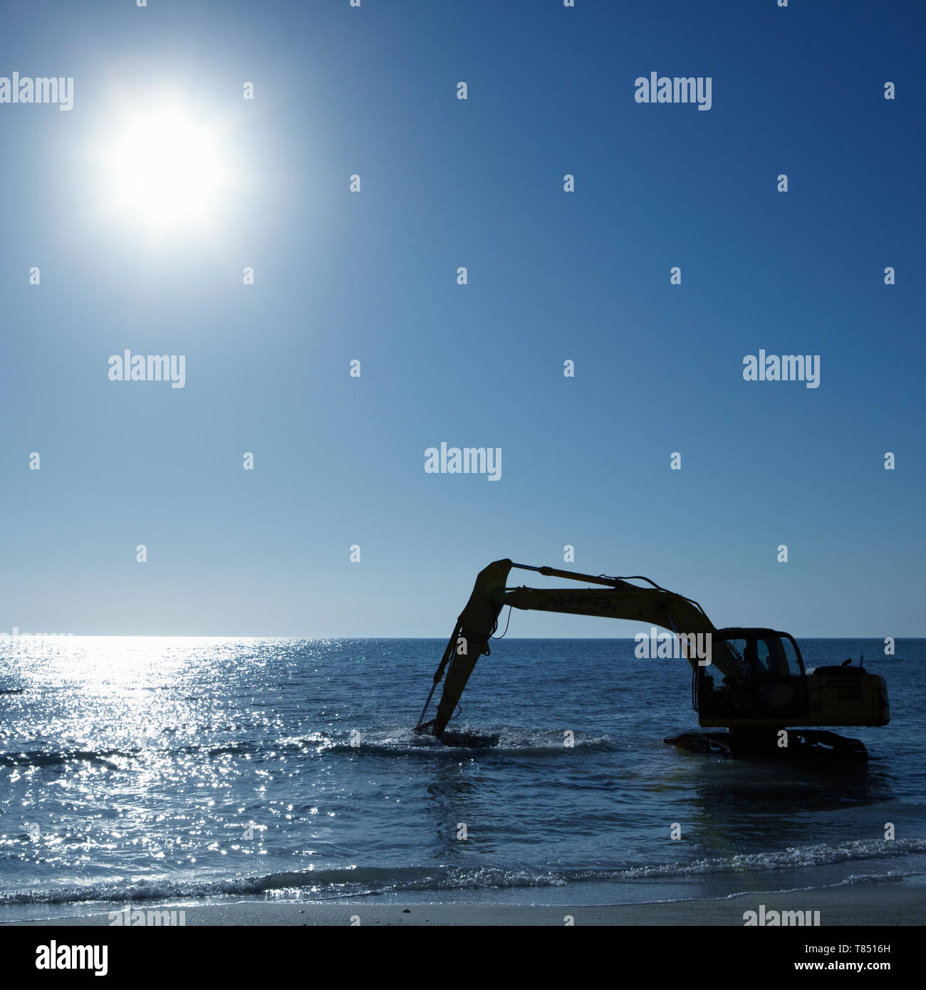 Excavator Digging in the Ocean Stock Photo - Alamy