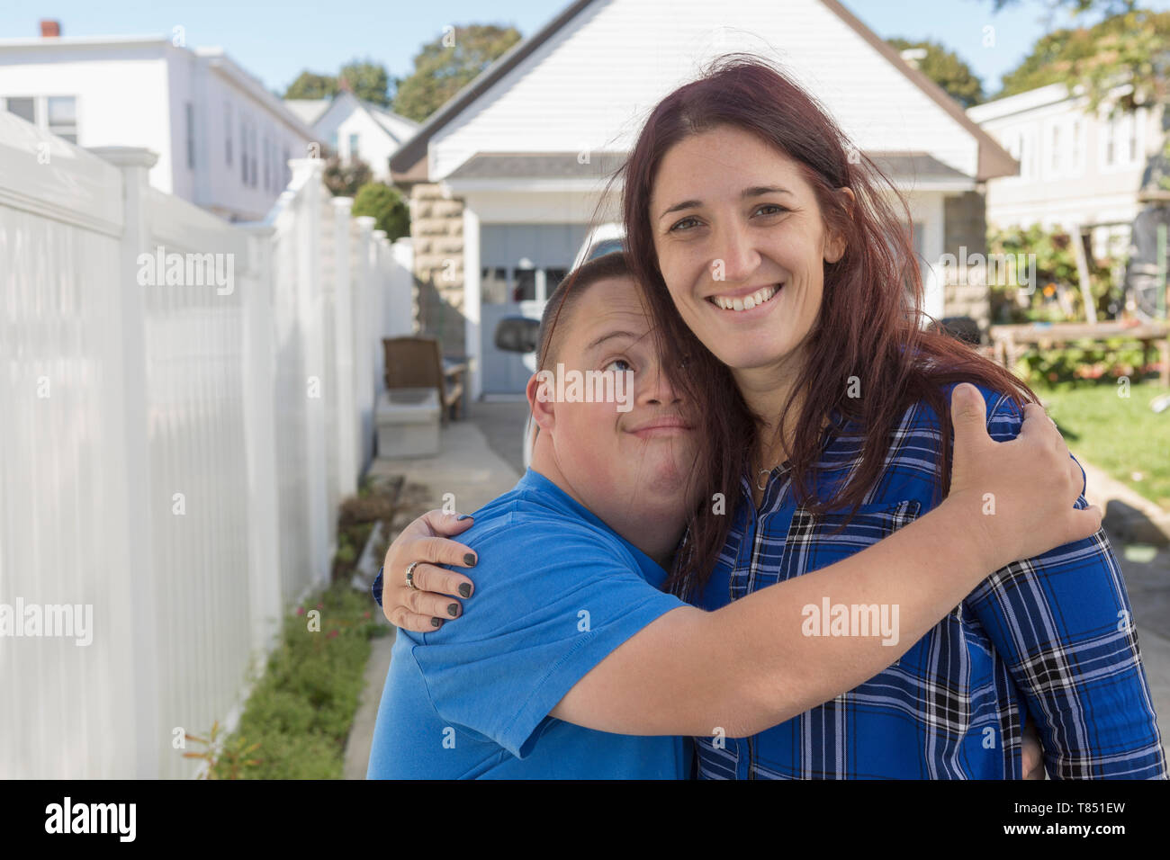 Teen who has Down Syndrome with his friend Stock Photo - Alamy