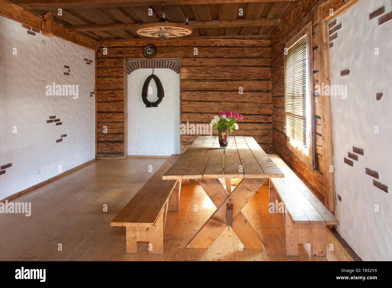 Cabin Interior With a Picnic Table Stock Photo - Alamy