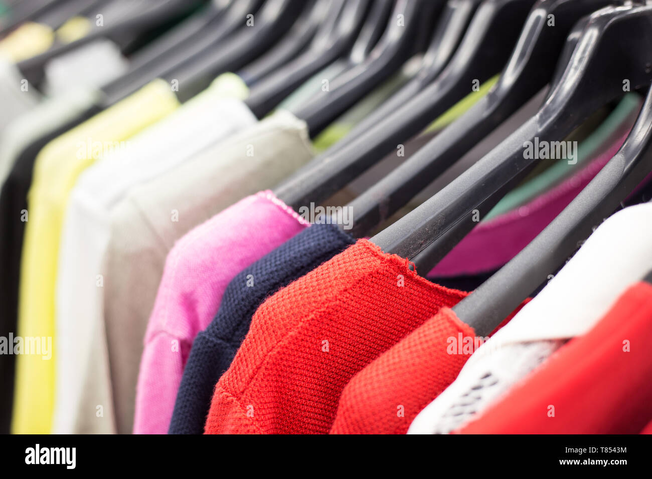 Clothes hanging in a shop Stock Photo - Alamy