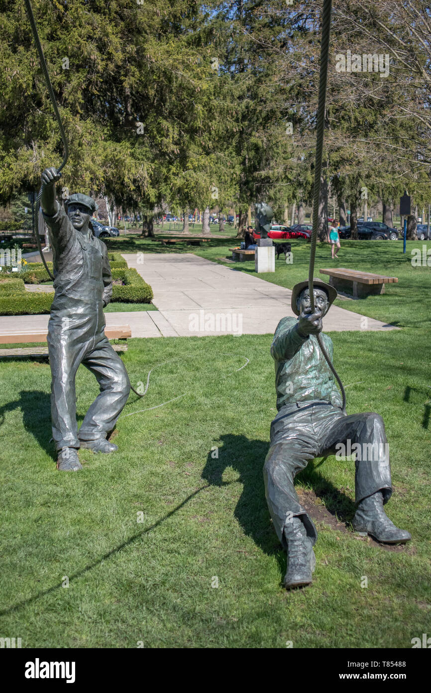 A sculpture representing men pulling the ropes or cables of the tent at ...