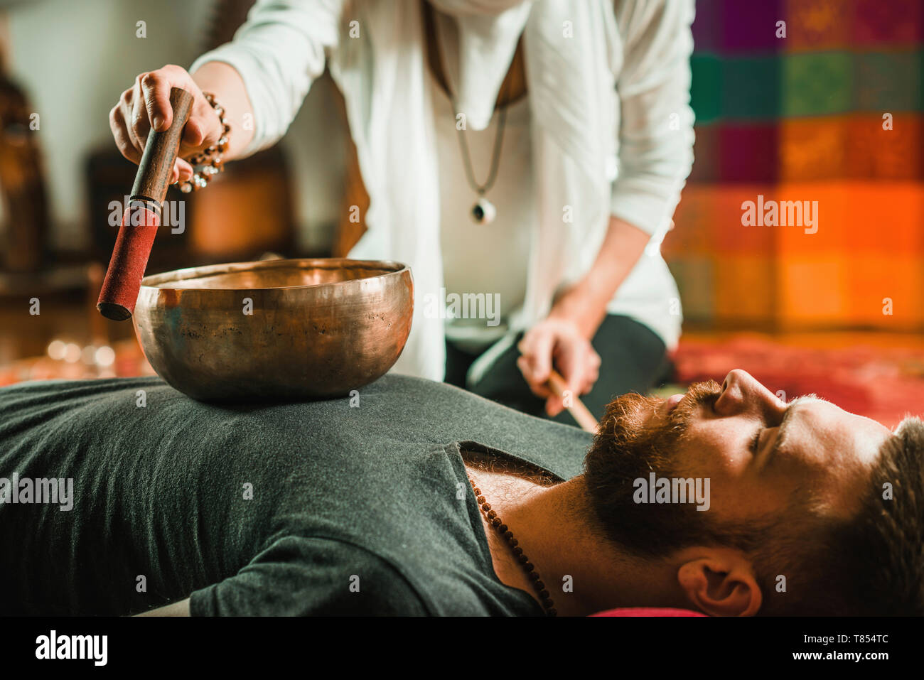 Tibetan singing bowl therapy Stock Photo - Alamy