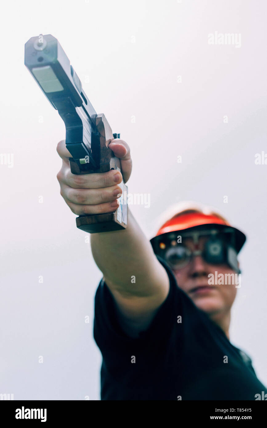 Woman practice shooting pistol hi-res stock photography and images - Alamy