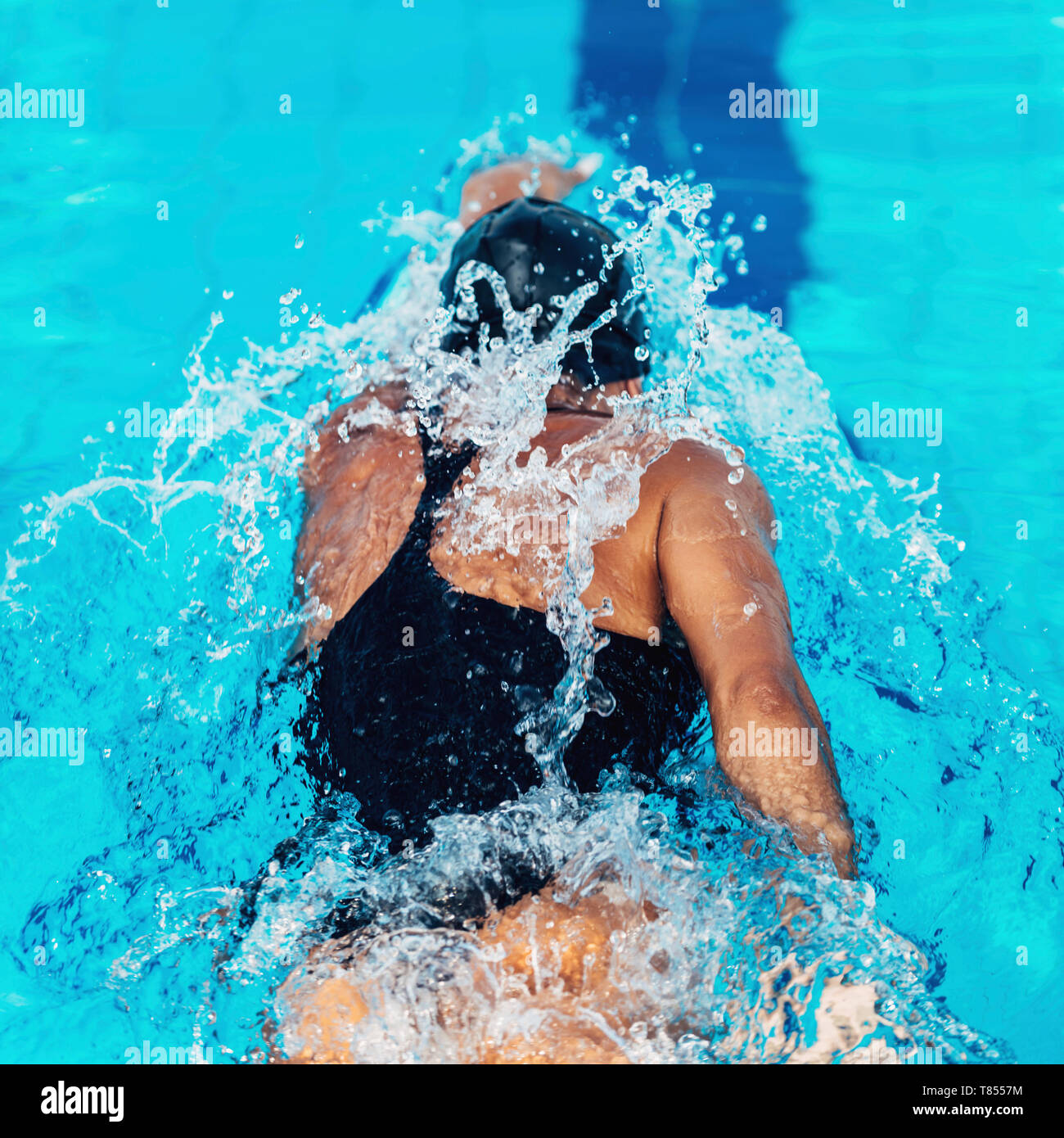 Woman swimming front crawl Stock Photo - Alamy