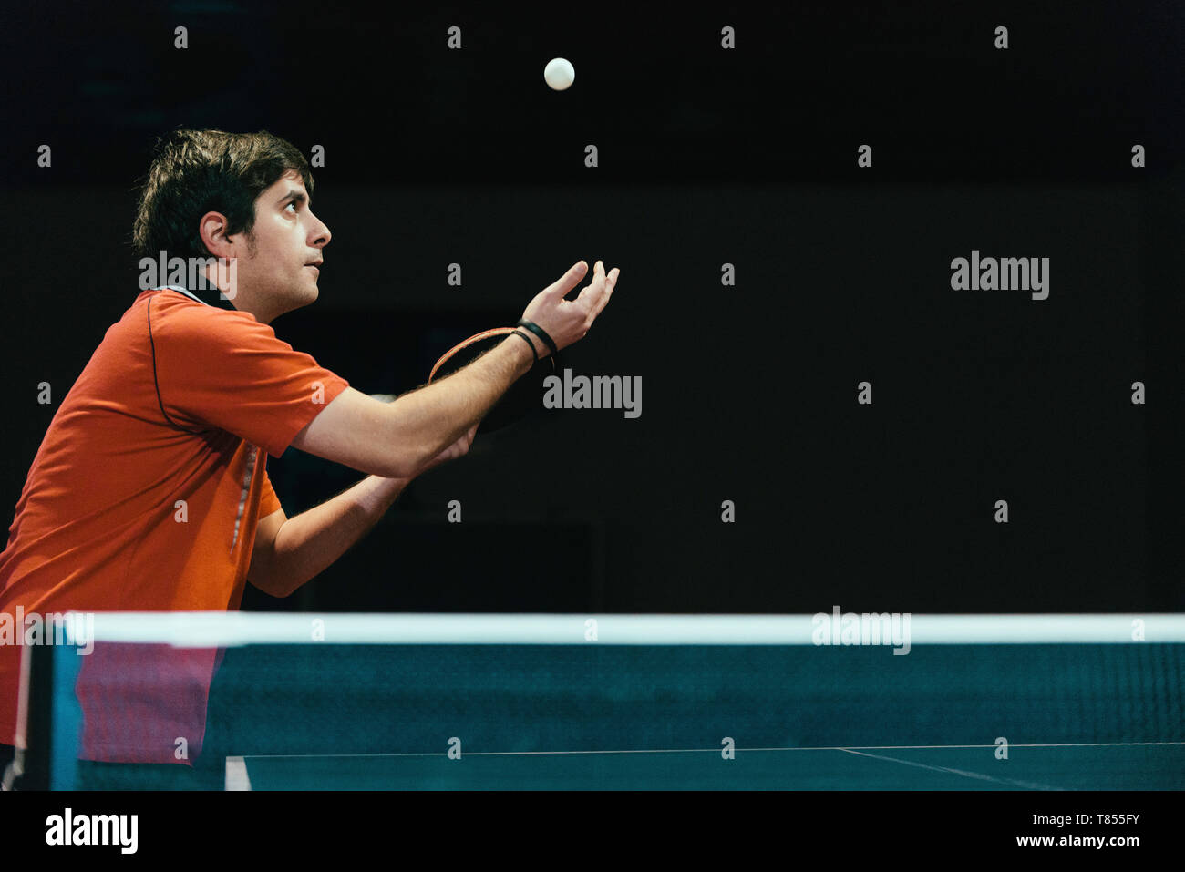 Table tennis player serving Stock Photo - Alamy