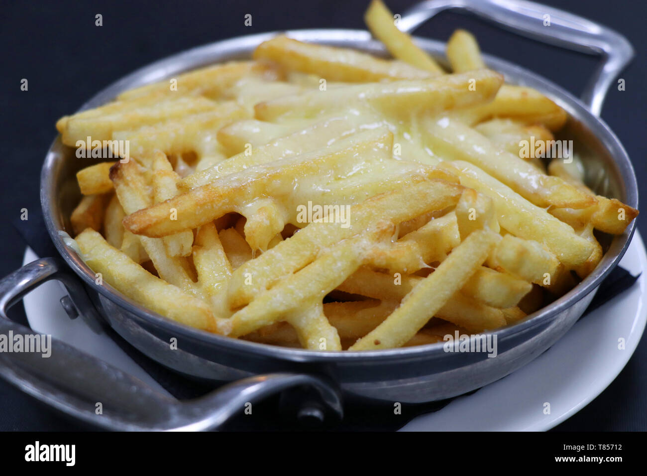 cheesy french fries Stock Photo - Alamy