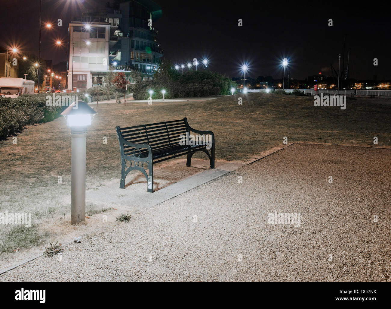 Urban Park Bench at Night Stock Photo - Alamy