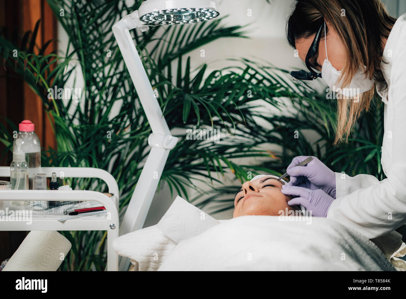 Professional eyebrow permanent makeup close hi-res stock photography ...