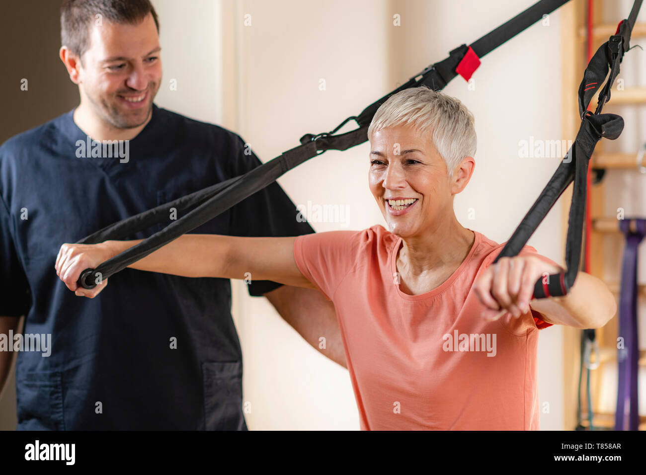 Senior woman with personal trainer Stock Photo - Alamy