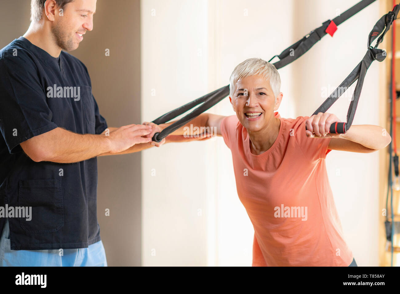 Senior woman with personal trainer Stock Photo - Alamy