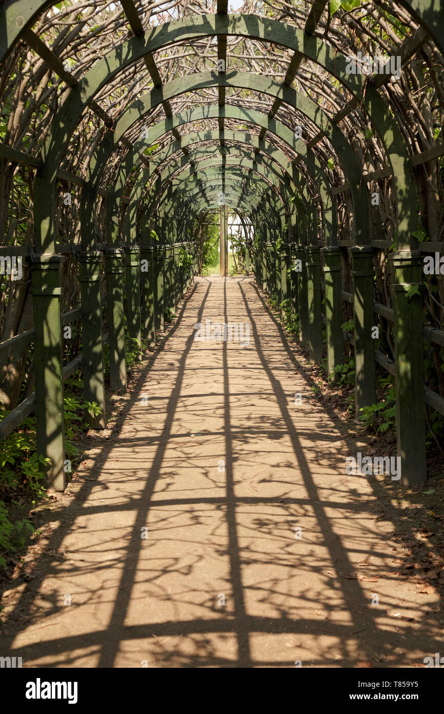 Long Garden Arch Passageway Stock Photo - Alamy