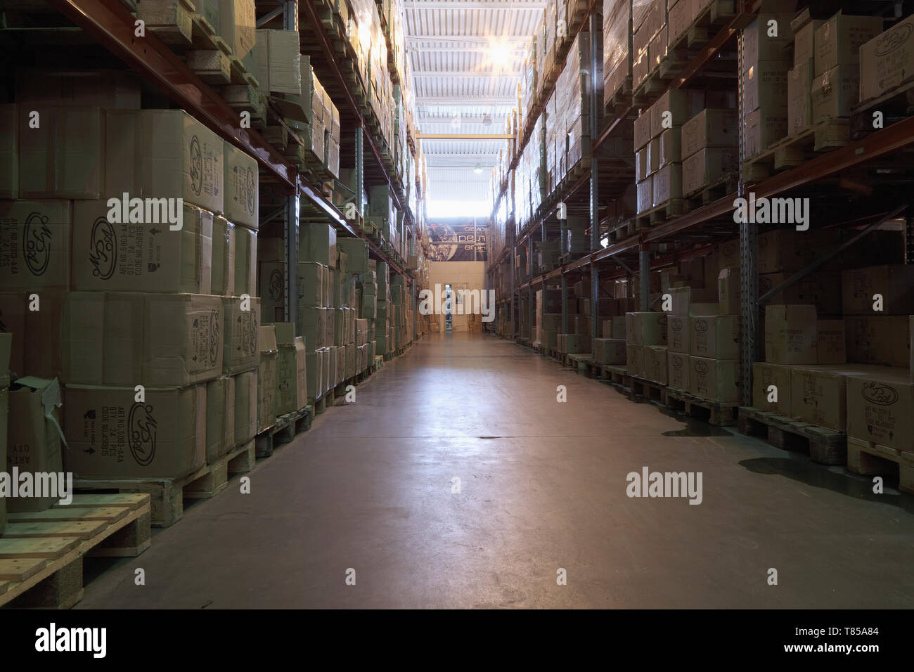 Dark Warehouse Aisle Stock Photo - Alamy