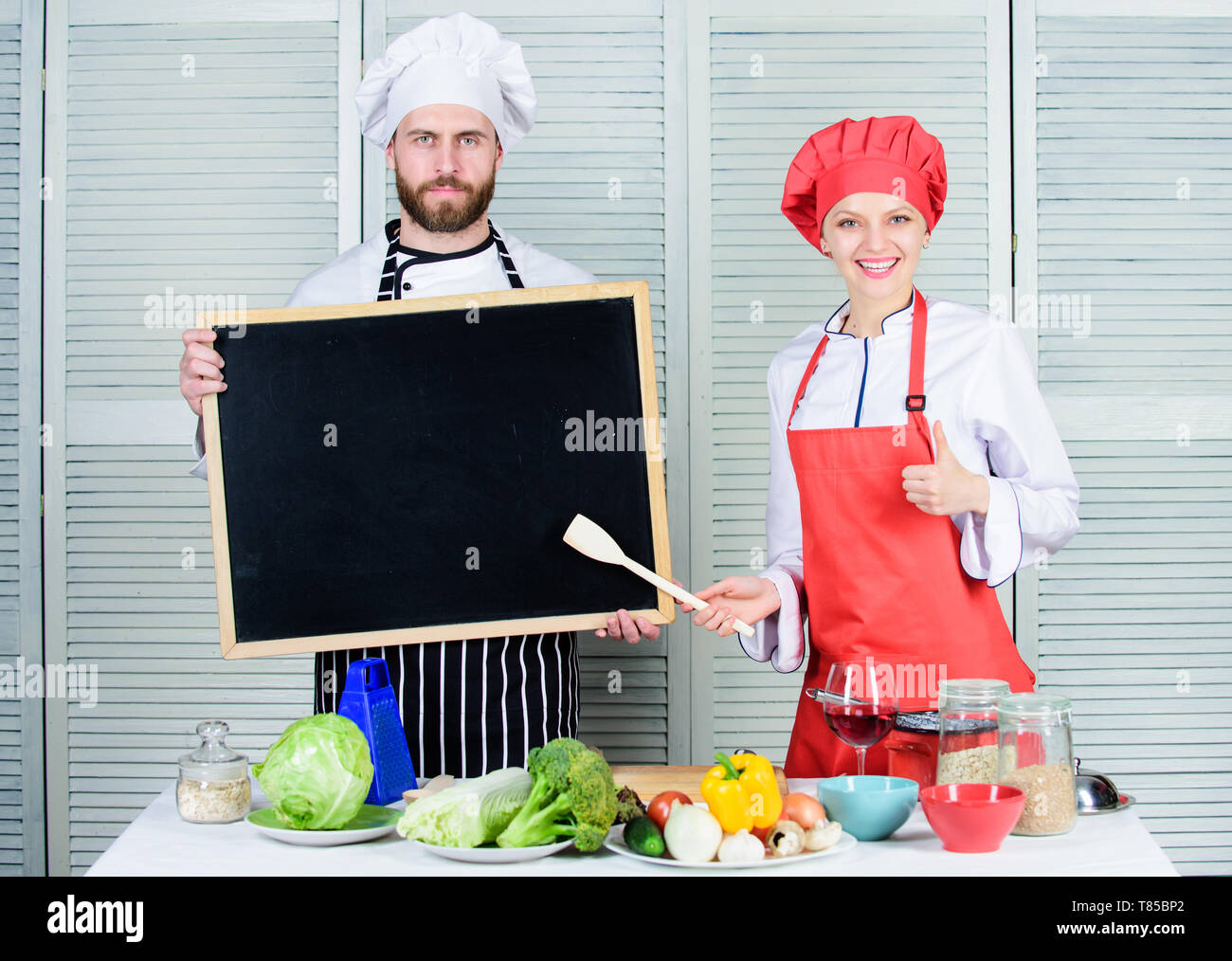 Hiring staff. Woman and man chef hold blackboard copy space. Job ...