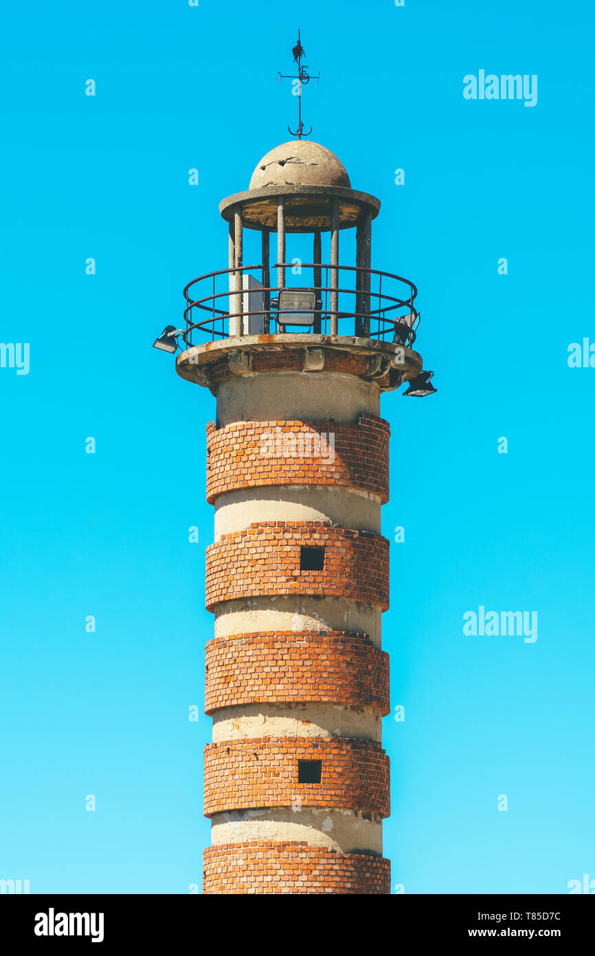 Old Brick Stone Lighthouse At Sea On Blue Sky Stock Photo - Alamy