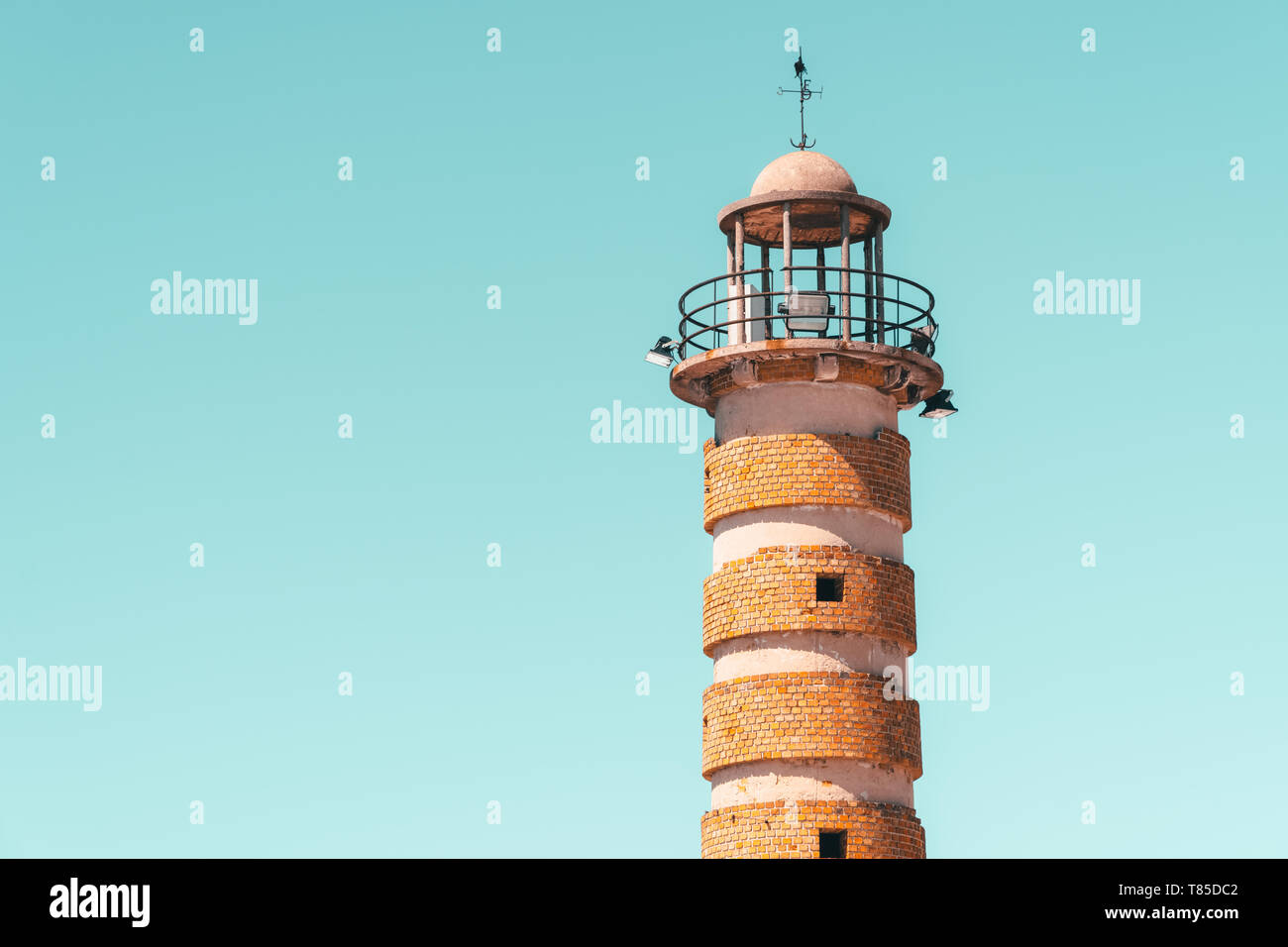Old Brick Stone Lighthouse At Sea On Blue Sky Stock Photo - Alamy