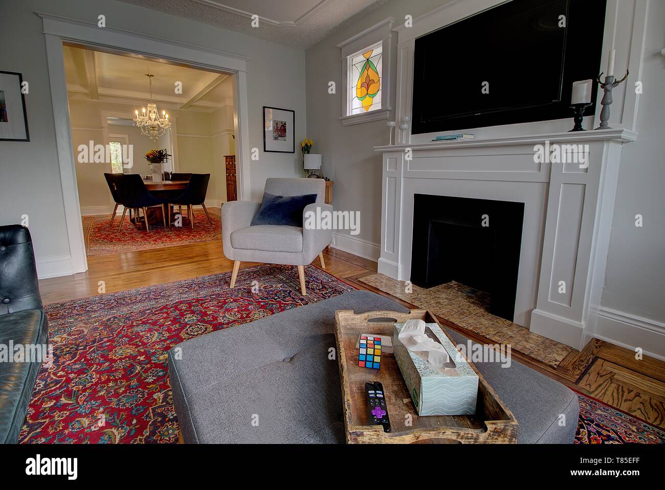 Beautiful modern updated home living room space with fireplace and t.v ...