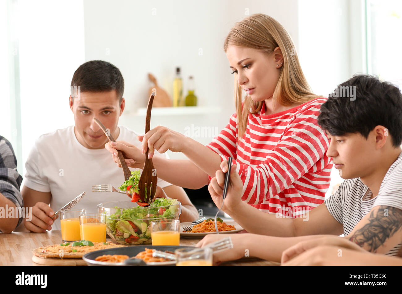 Male friends kitchen vegetables hi-res stock photography and images - Alamy