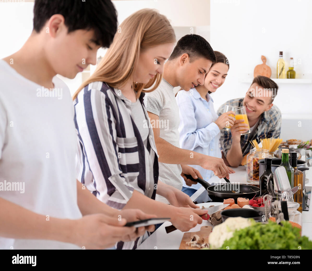 Young friends fun frying hi-res stock photography and images - Alamy