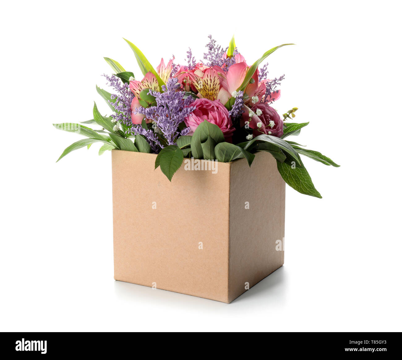 Gift box with beautiful flowers on white background Stock Photo - Alamy