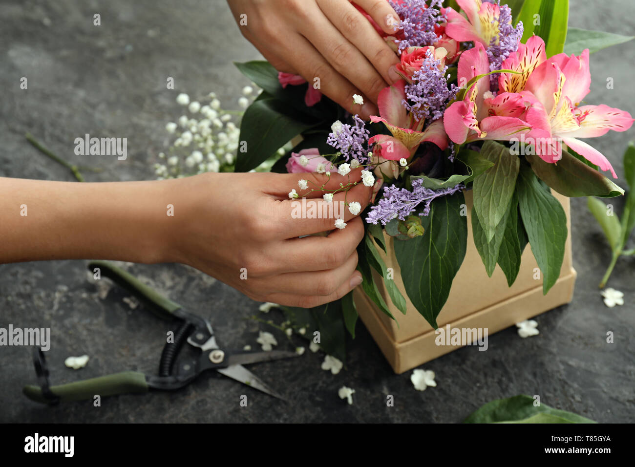 Female florist preparing box hi-res stock photography and images - Alamy