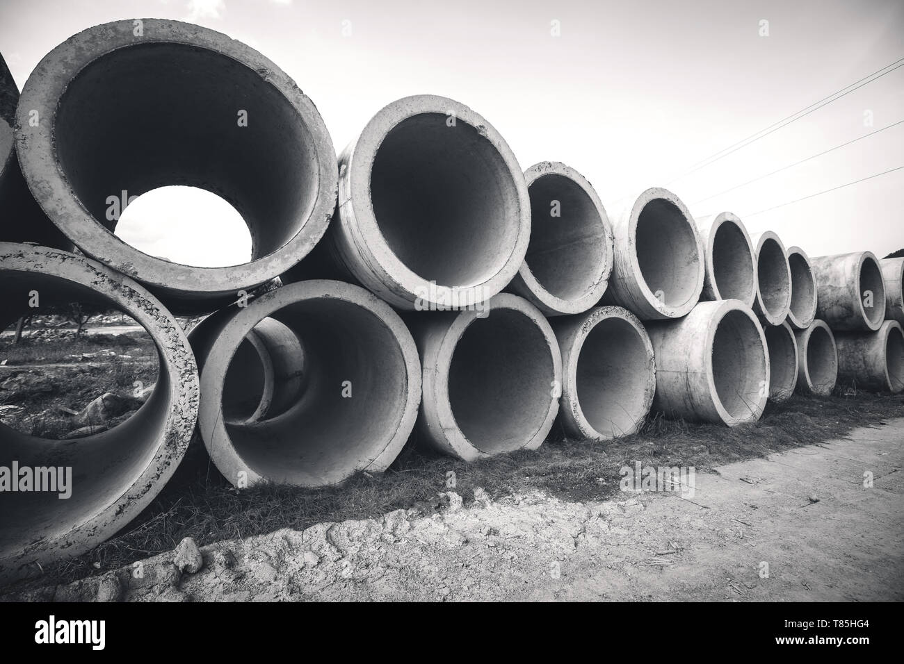 Concrete water pipe on the ground Stock Photo - Alamy