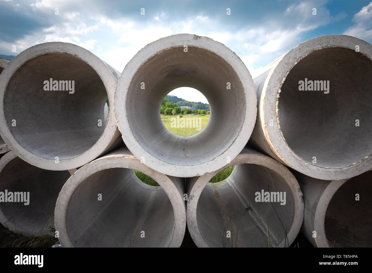 Concrete water pipe on the ground Stock Photo - Alamy