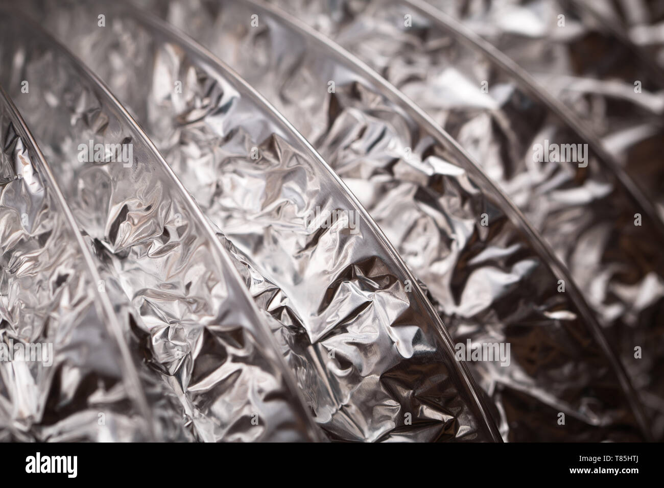 Silver tinfoil tube for ventilator Stock Photo - Alamy