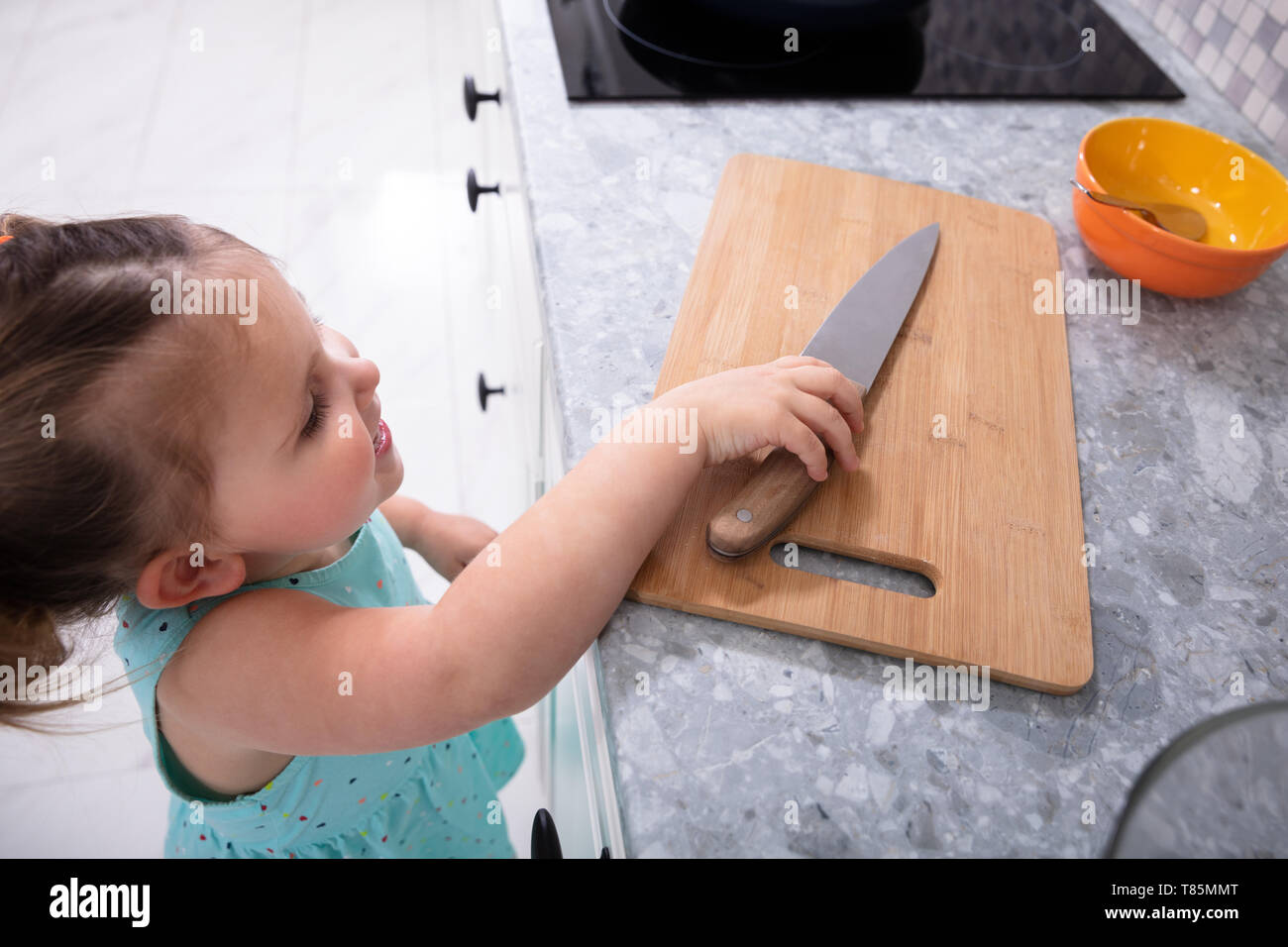Happy Little Baby Girl Taking Kitchen Knife Stock Photo - Alamy