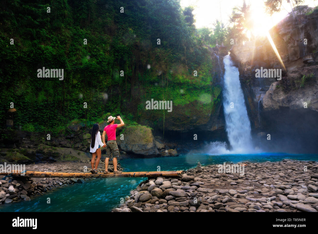 Loving couple by the waterfall Stock Photo - Alamy