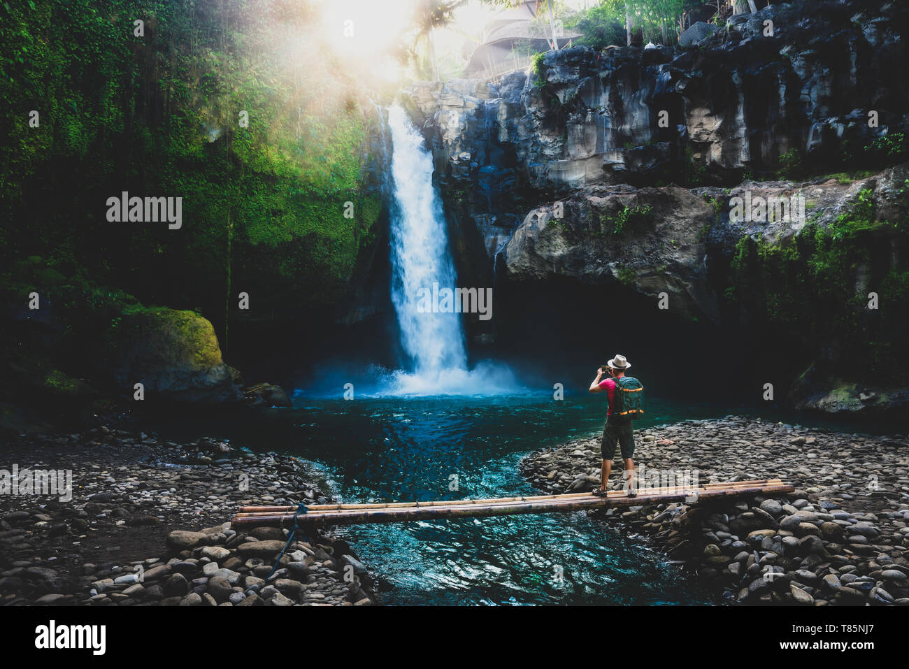 Tourist enjoying at beautiful waterfall Stock Photo - Alamy