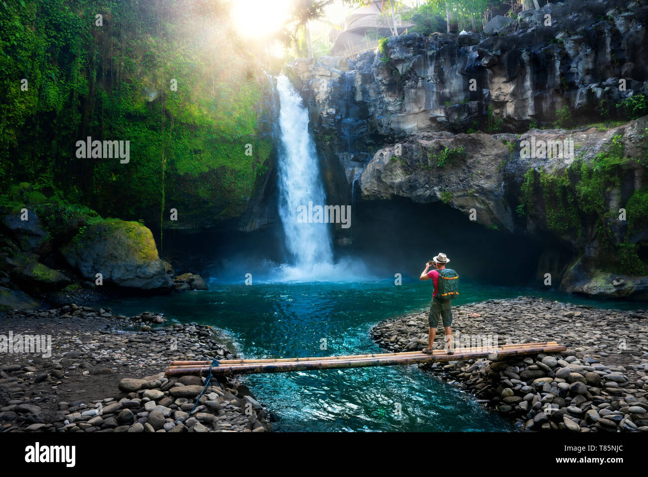 Active lifestyle traveller backpacker make photo amazing waterfall ...