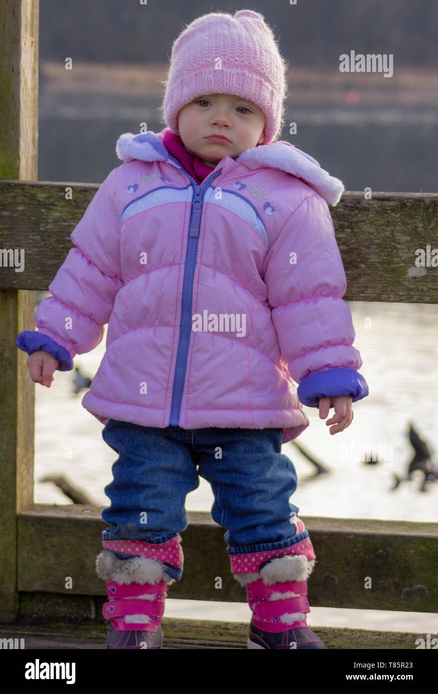 20 months old baby is enjoying the nice Winter weather. Bundled up for ...