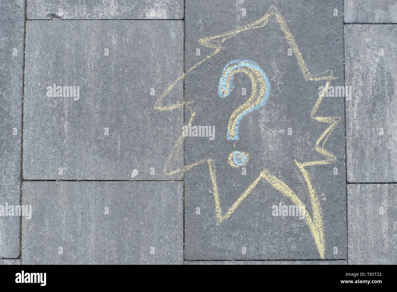 Abstract question mark drawn in crayons on gray asphalt, top view Stock ...