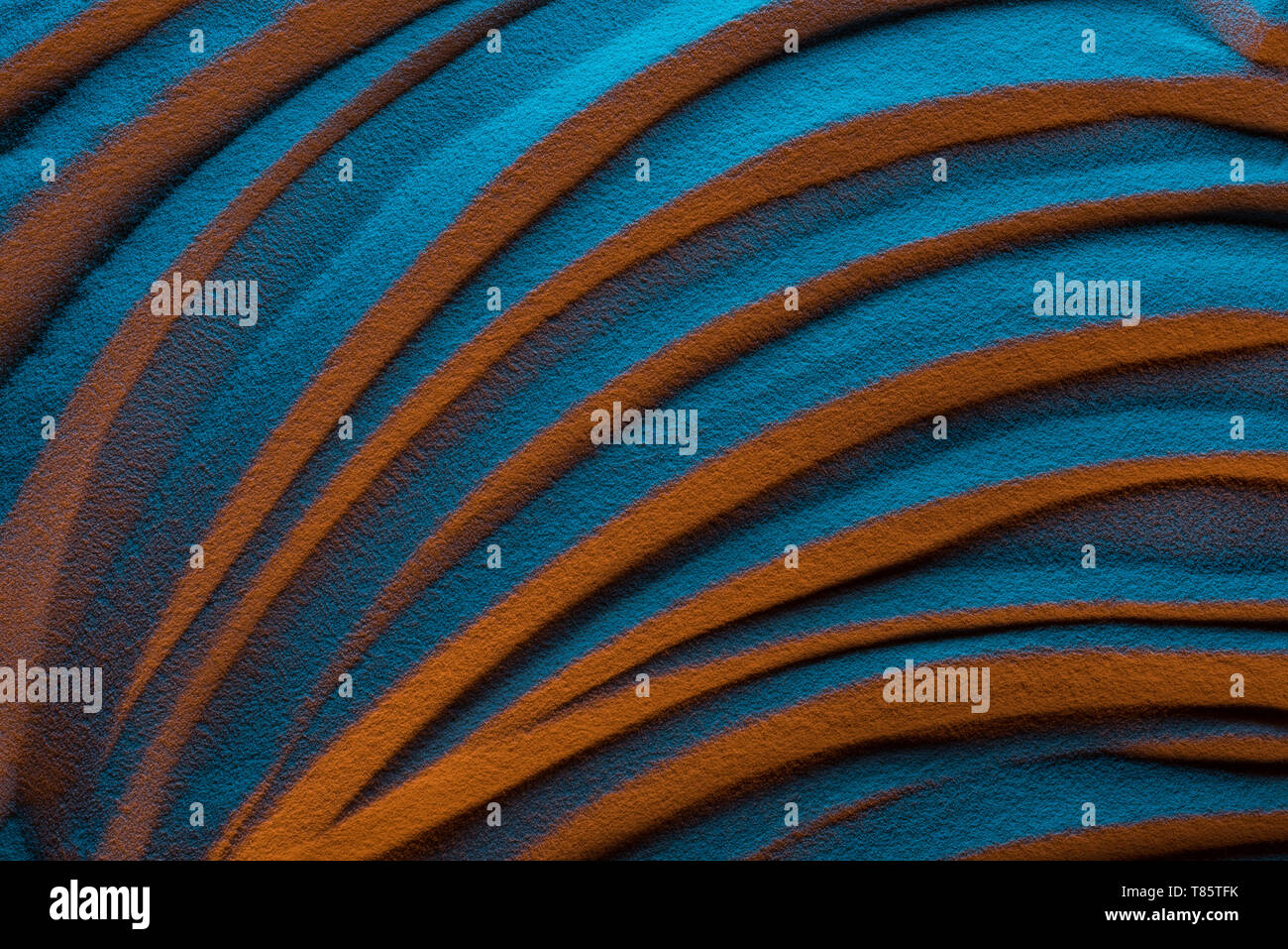 top view of textured sand with waves and blue color filter Stock Photo ...