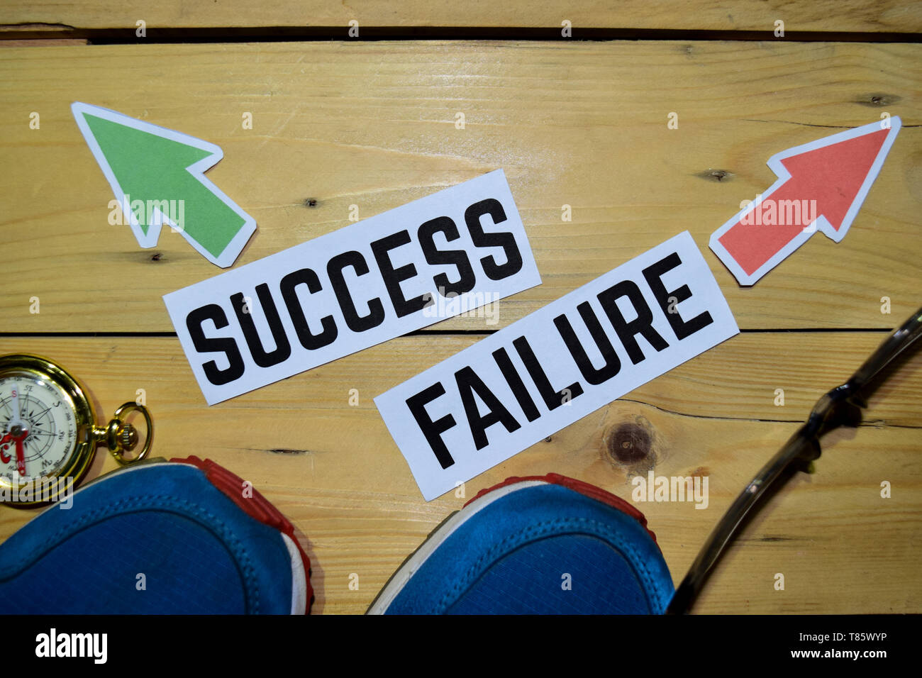 Success or Failure opposite direction signs with sneakers,eyeglasses ...