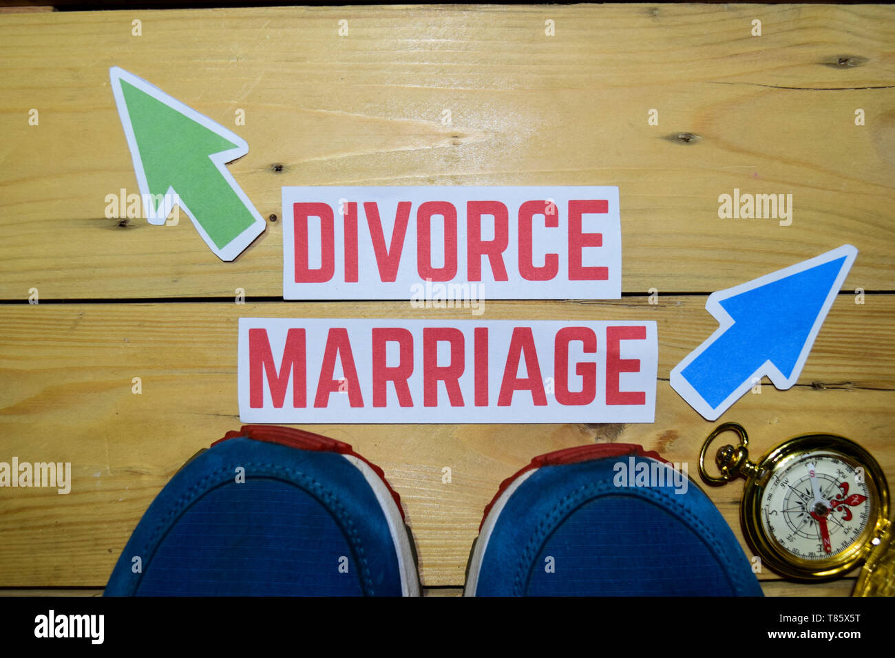 Divorce or Marriage opposite direction signs with sneakers and compass ...