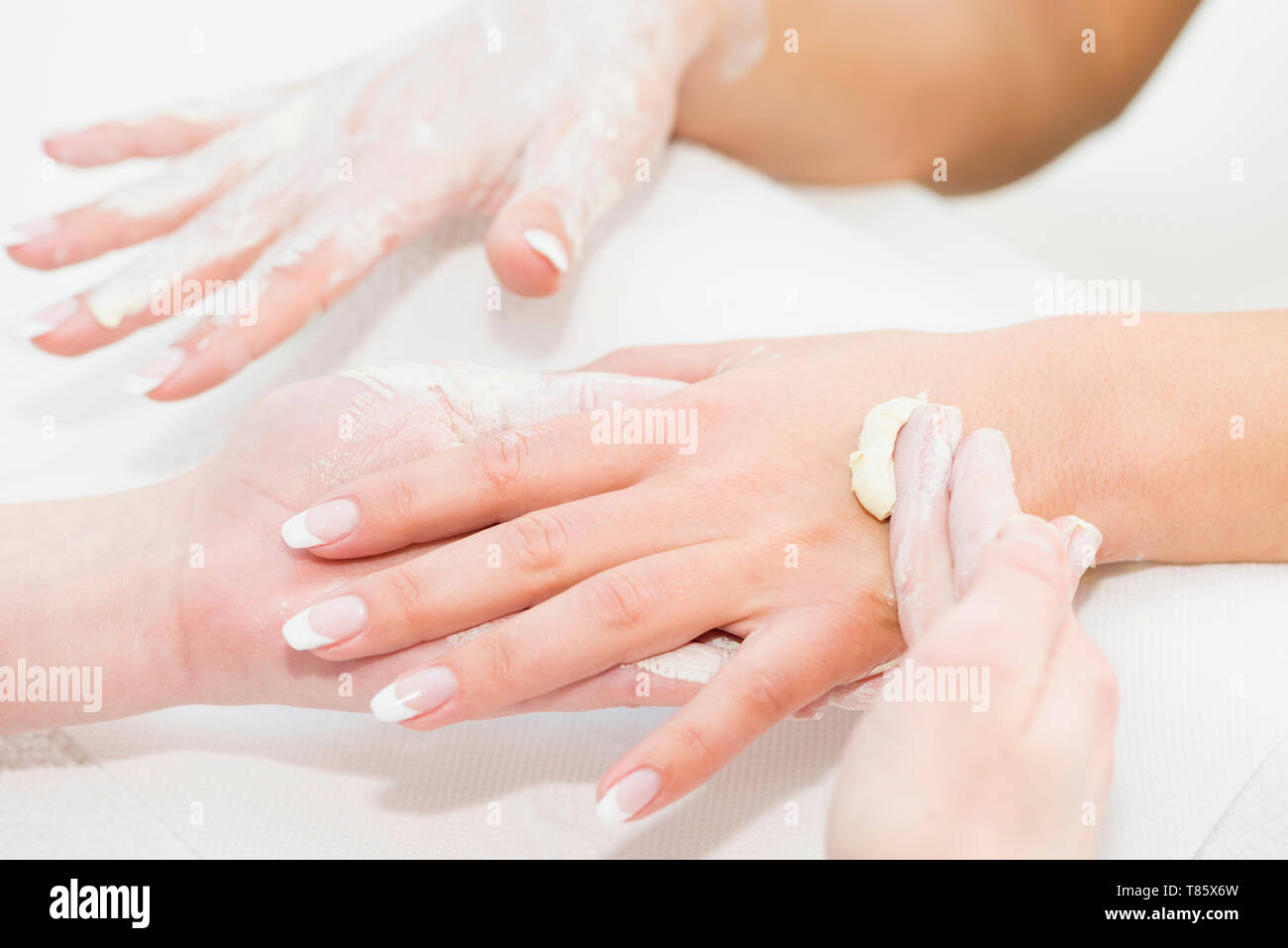 Hand cream application Stock Photo - Alamy