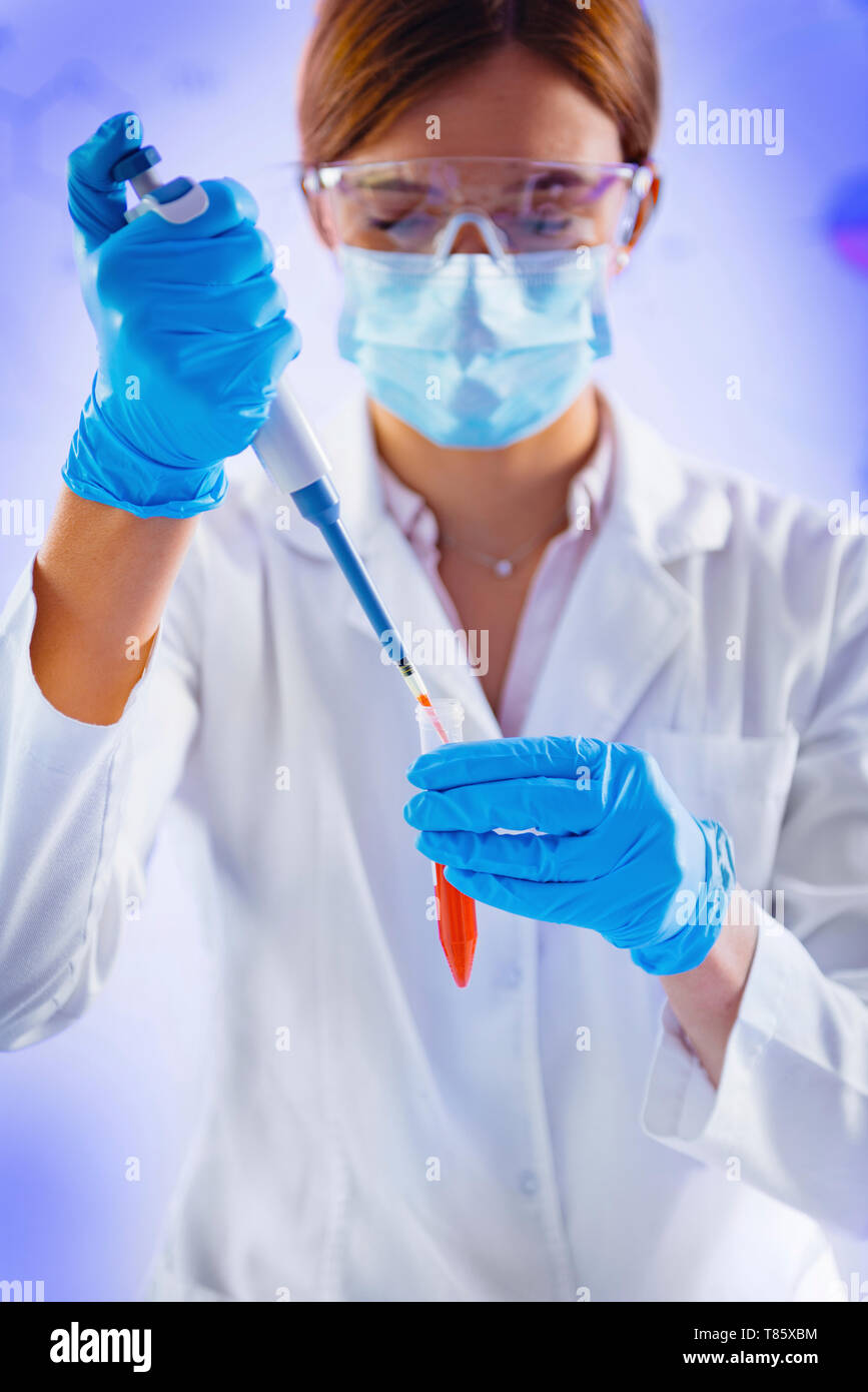 Scientist pipetting sample phial hi-res stock photography and images ...