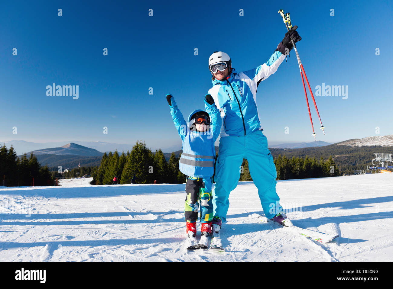 Father and son skiing Stock Photo - Alamy