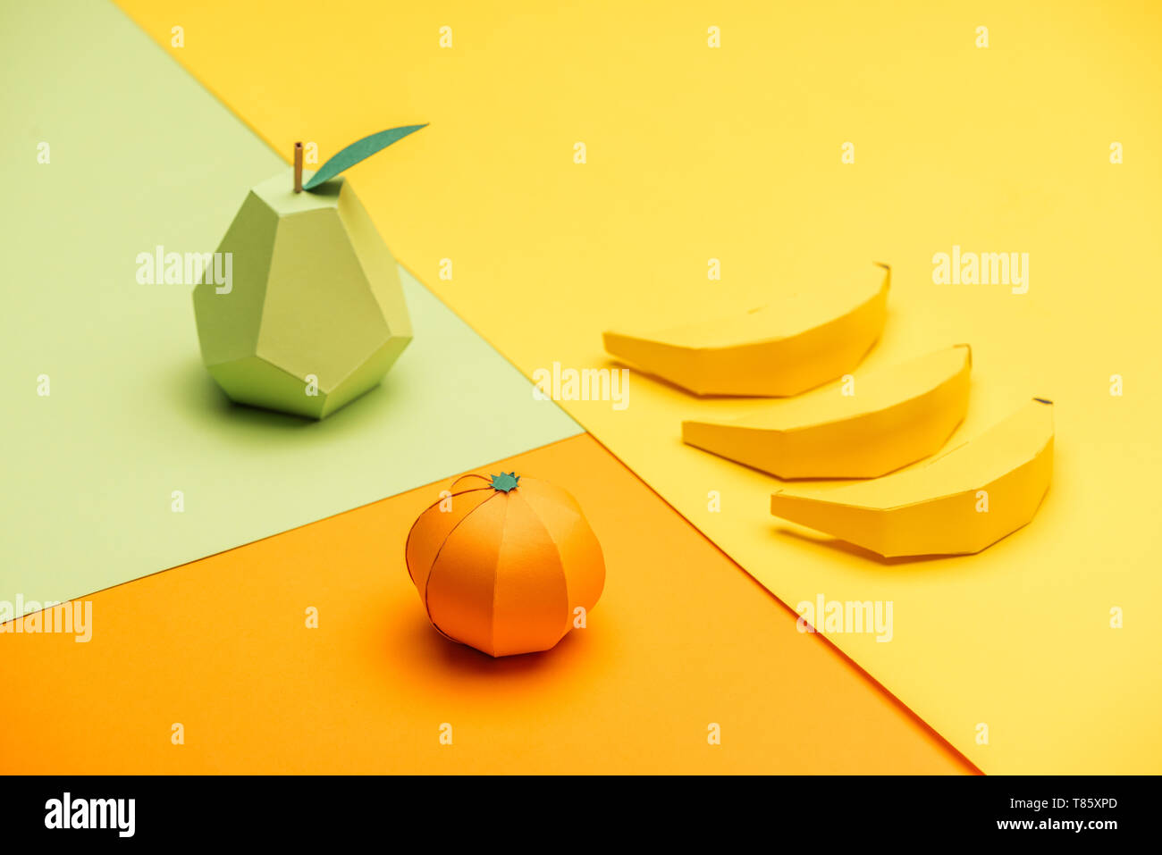 handmade origami pear, bananas and tangerine on colorful paper Stock ...
