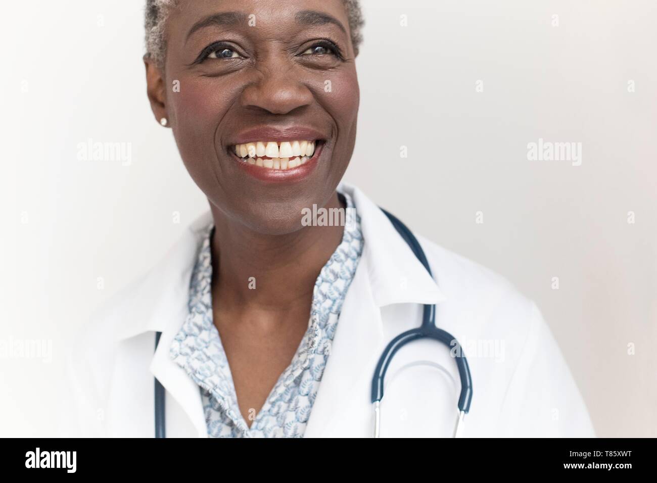 Female doctor smiling Stock Photo - Alamy