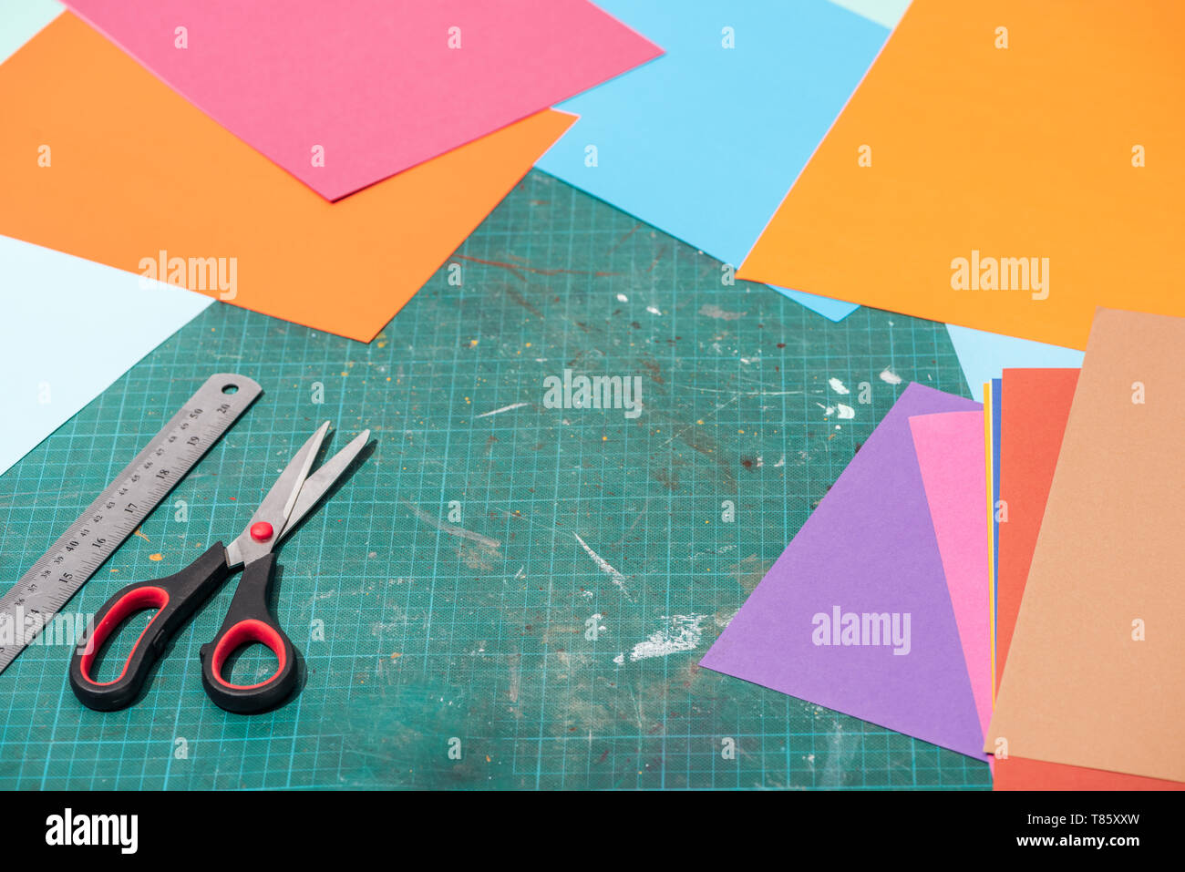 colorful cardboard with scissors and ruler on messy surface Stock Photo ...