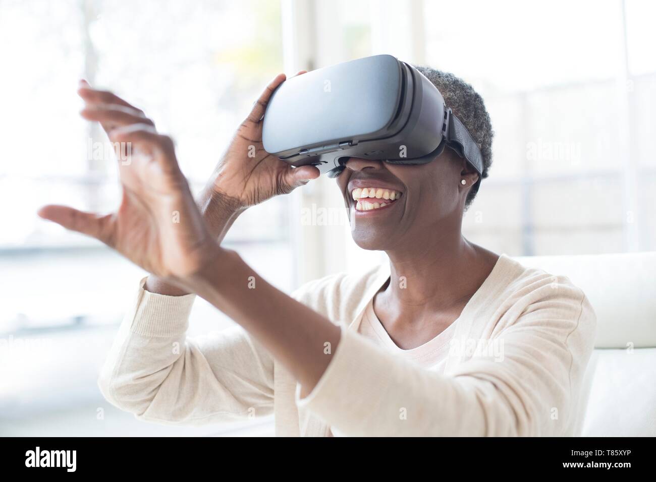 Woman wearing VR headset Stock Photo - Alamy