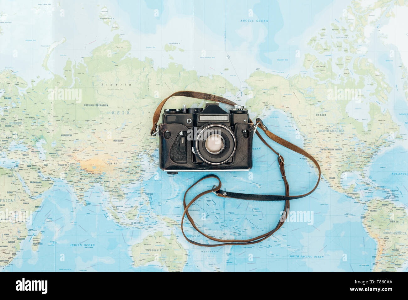 Top view of black film camera on world map Stock Photo - Alamy