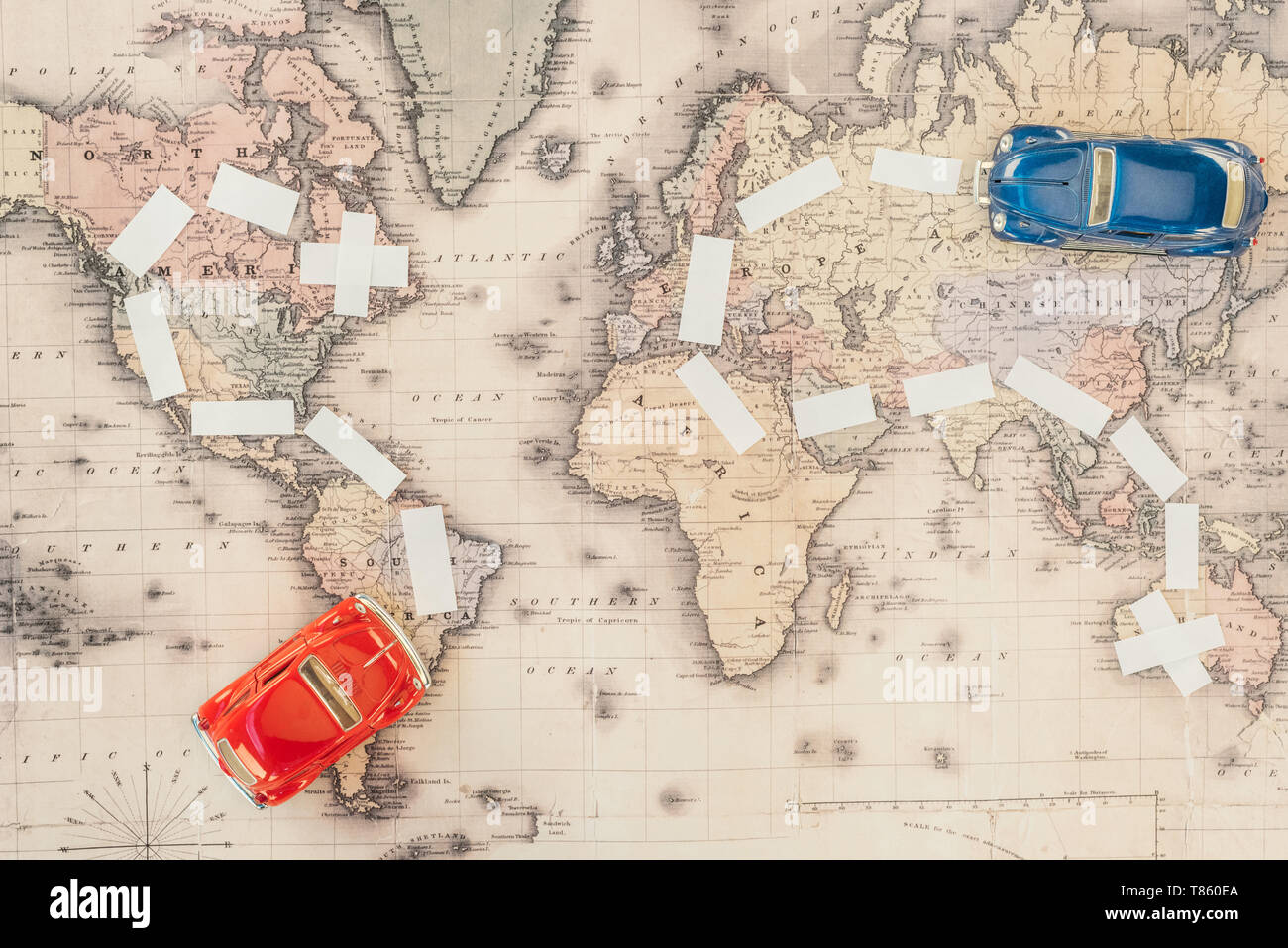 Top view of red and blue toy cars on world map Stock Photo - Alamy