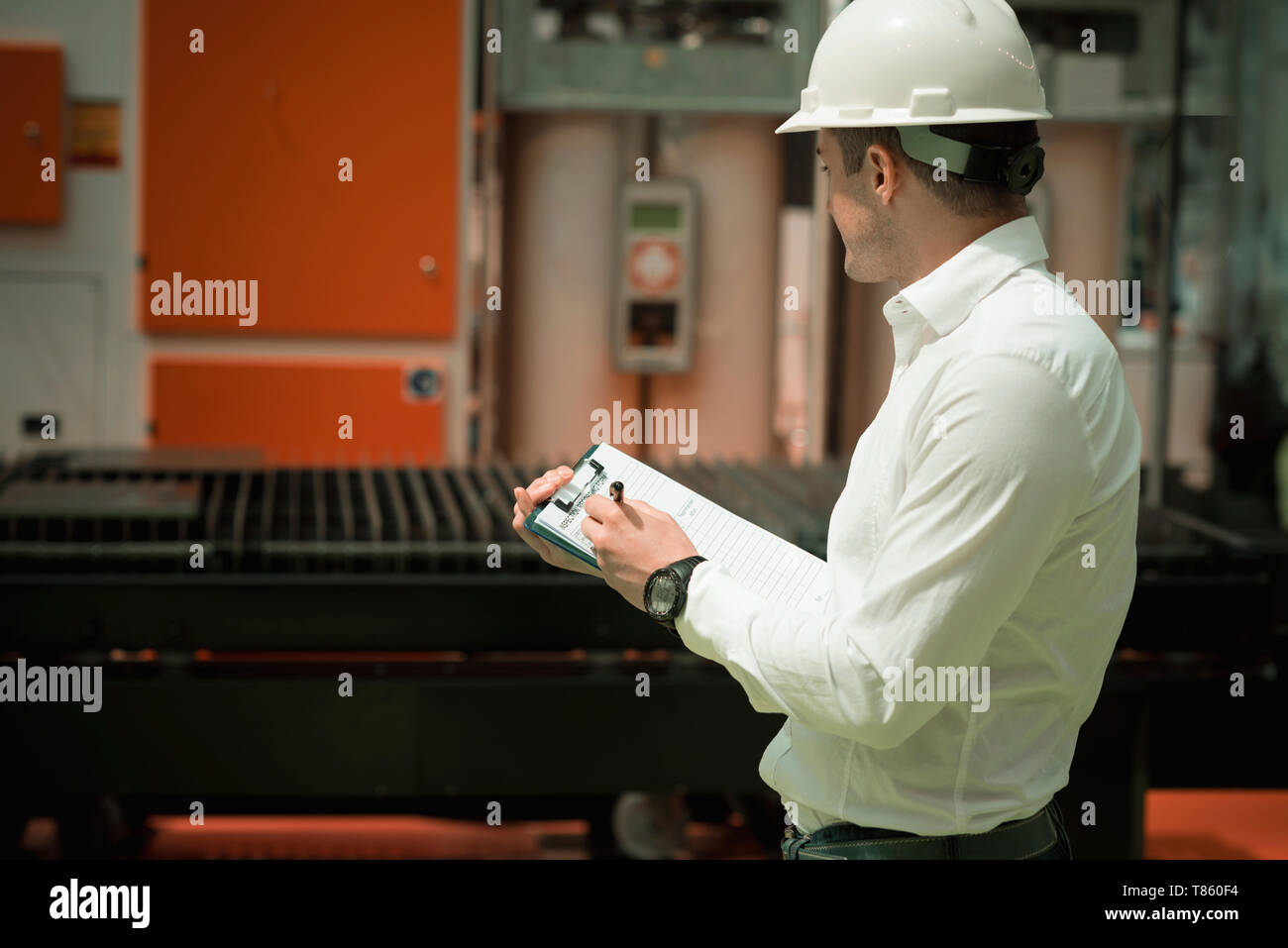 Engineer working in factory Stock Photo - Alamy